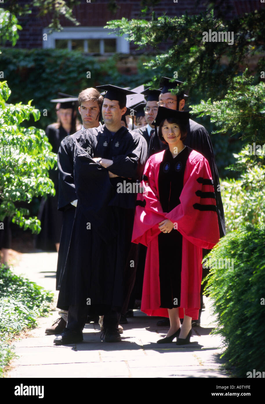 Harvard Univeristy graduates line up for presentation of diplomas ...
