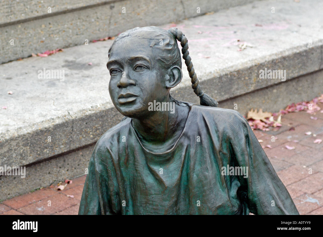 Young girl listens intently - one of the statues at the Alex Haley ...