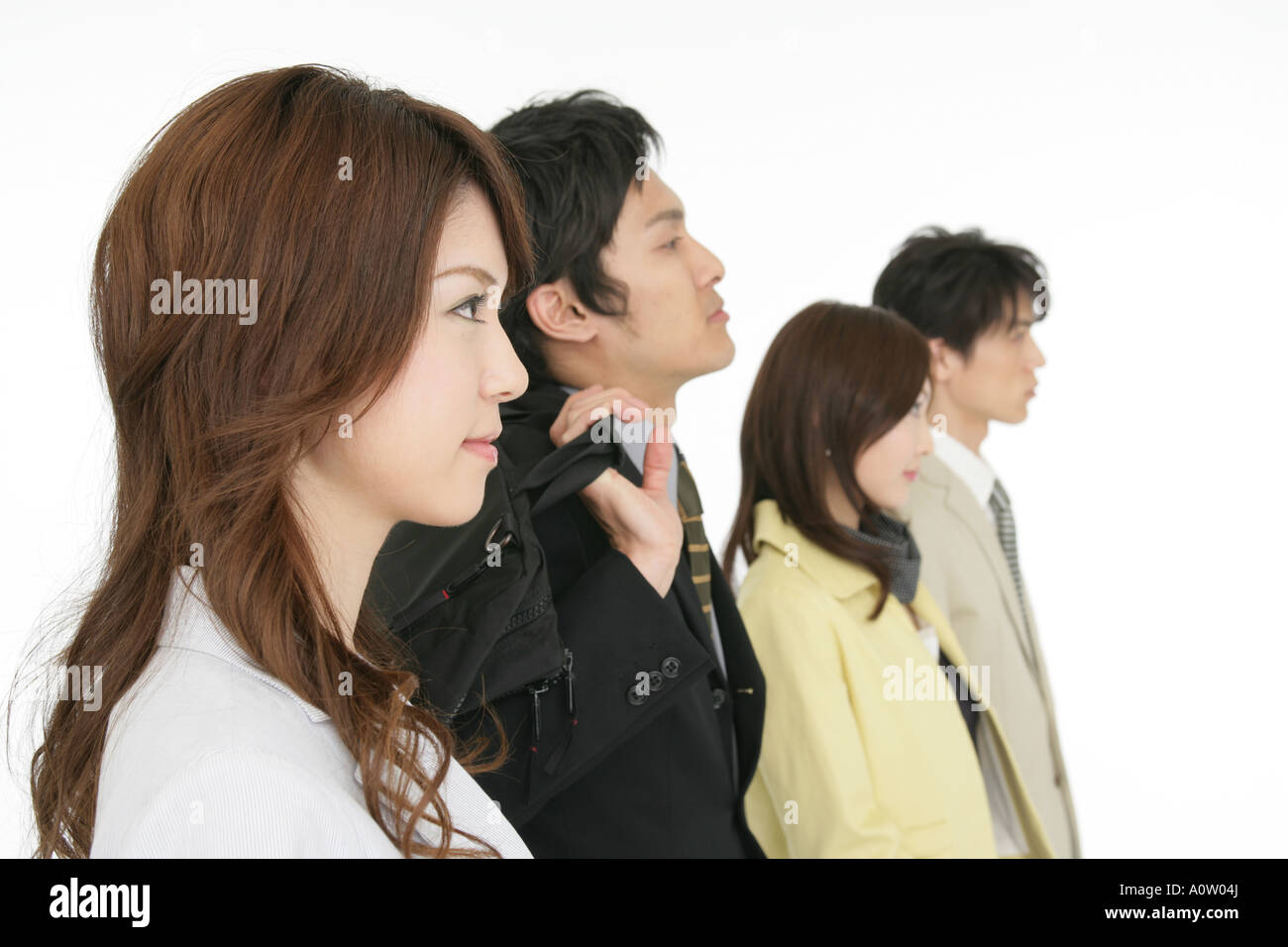 Side profile of two businesswomen and two businessmen in a row Stock ...