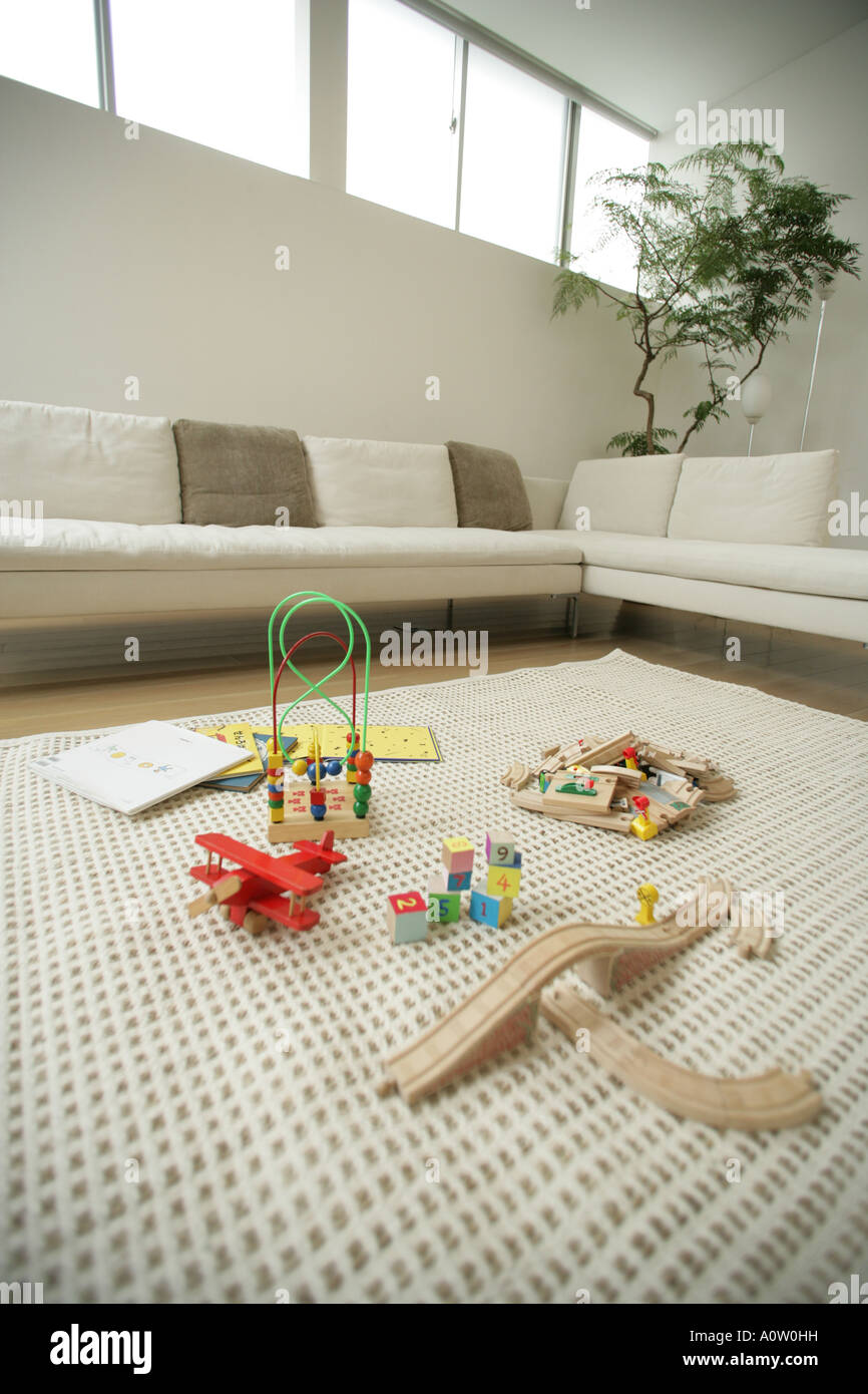Toys on a mat in the living room Stock Photo - Alamy