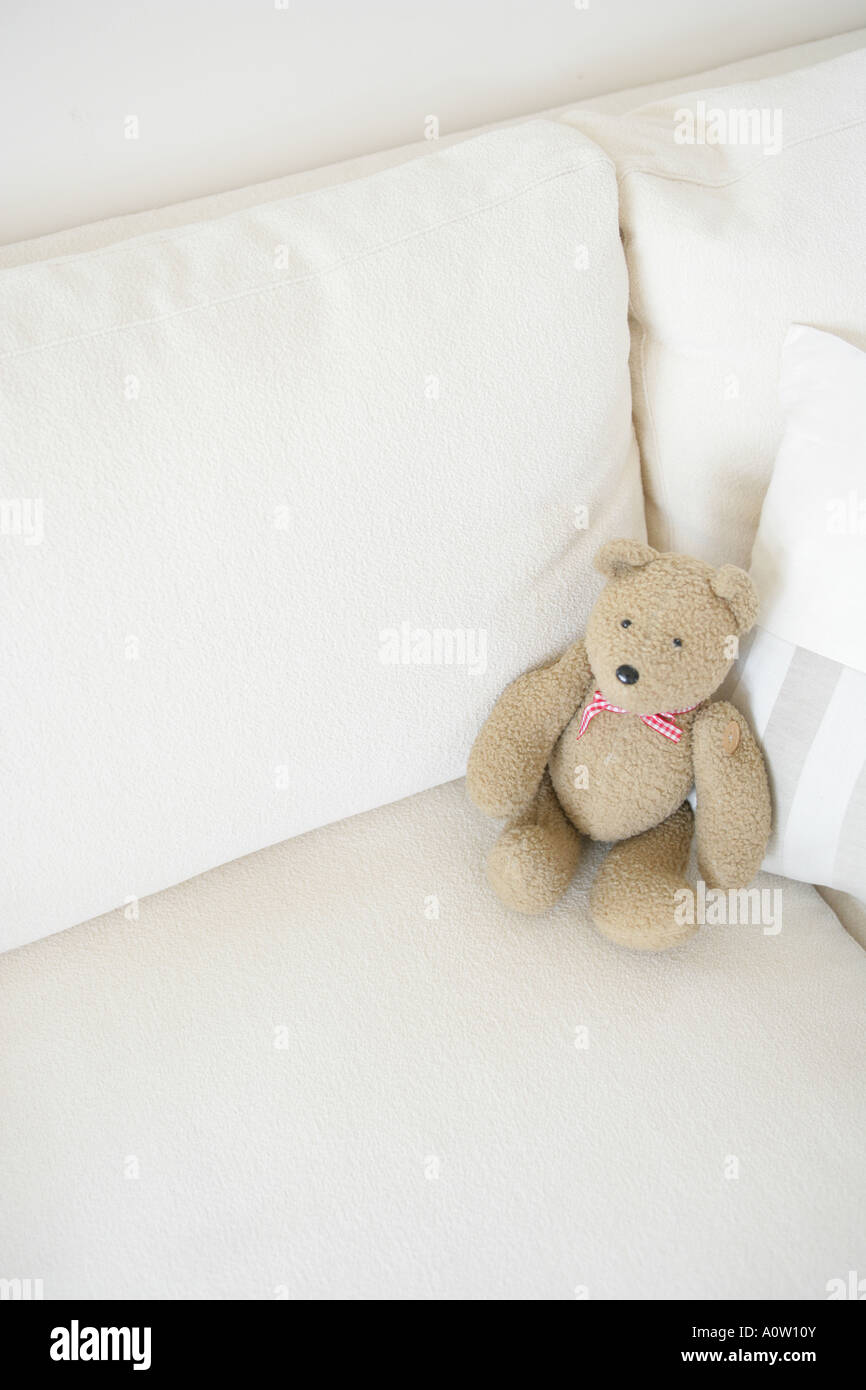 Teddy bear on a couch Stock Photo - Alamy