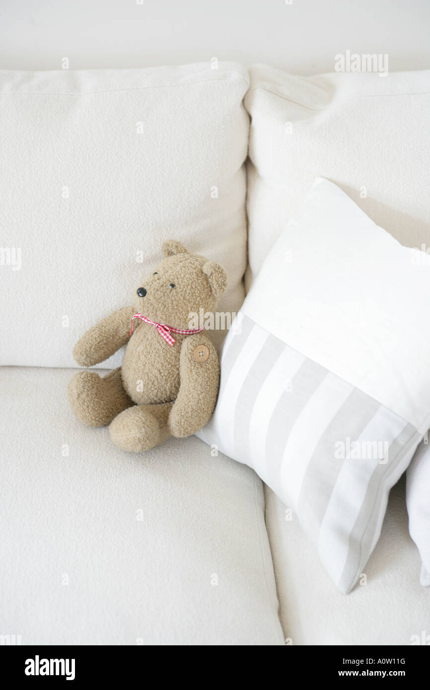 Teddy bear on a couch Stock Photo - Alamy
