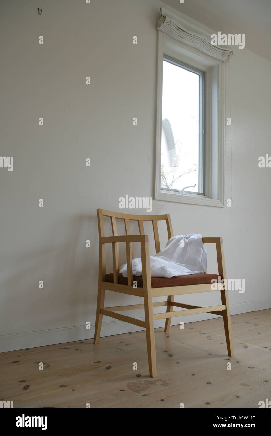 Empty chair in a living room Stock Photo - Alamy