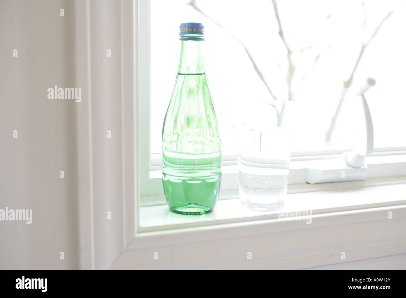 Water bottle with a glass near a window Stock Photo - Alamy