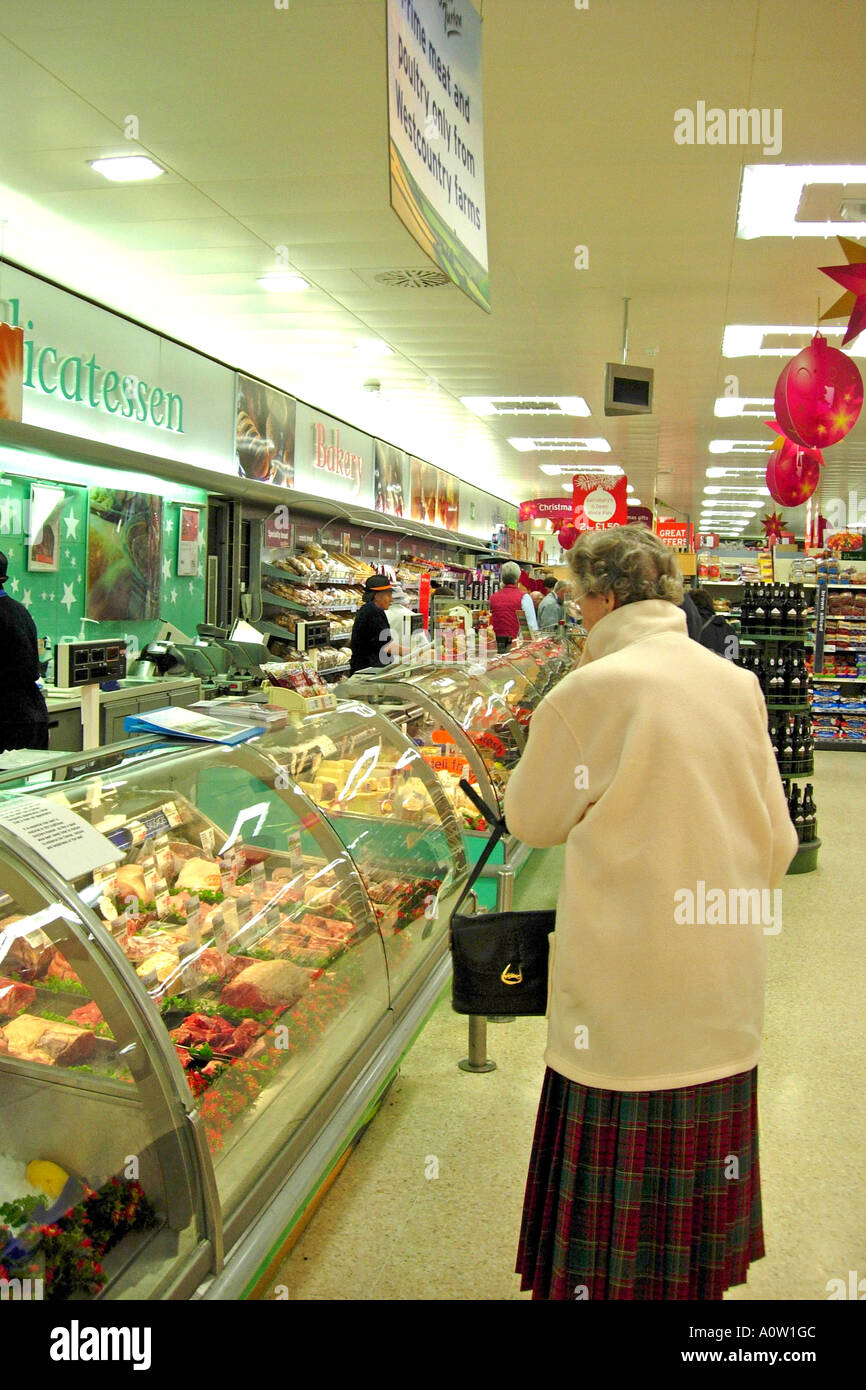 Shoppers at the Deli Counter in a Supermarket Stock Photo - Alamy