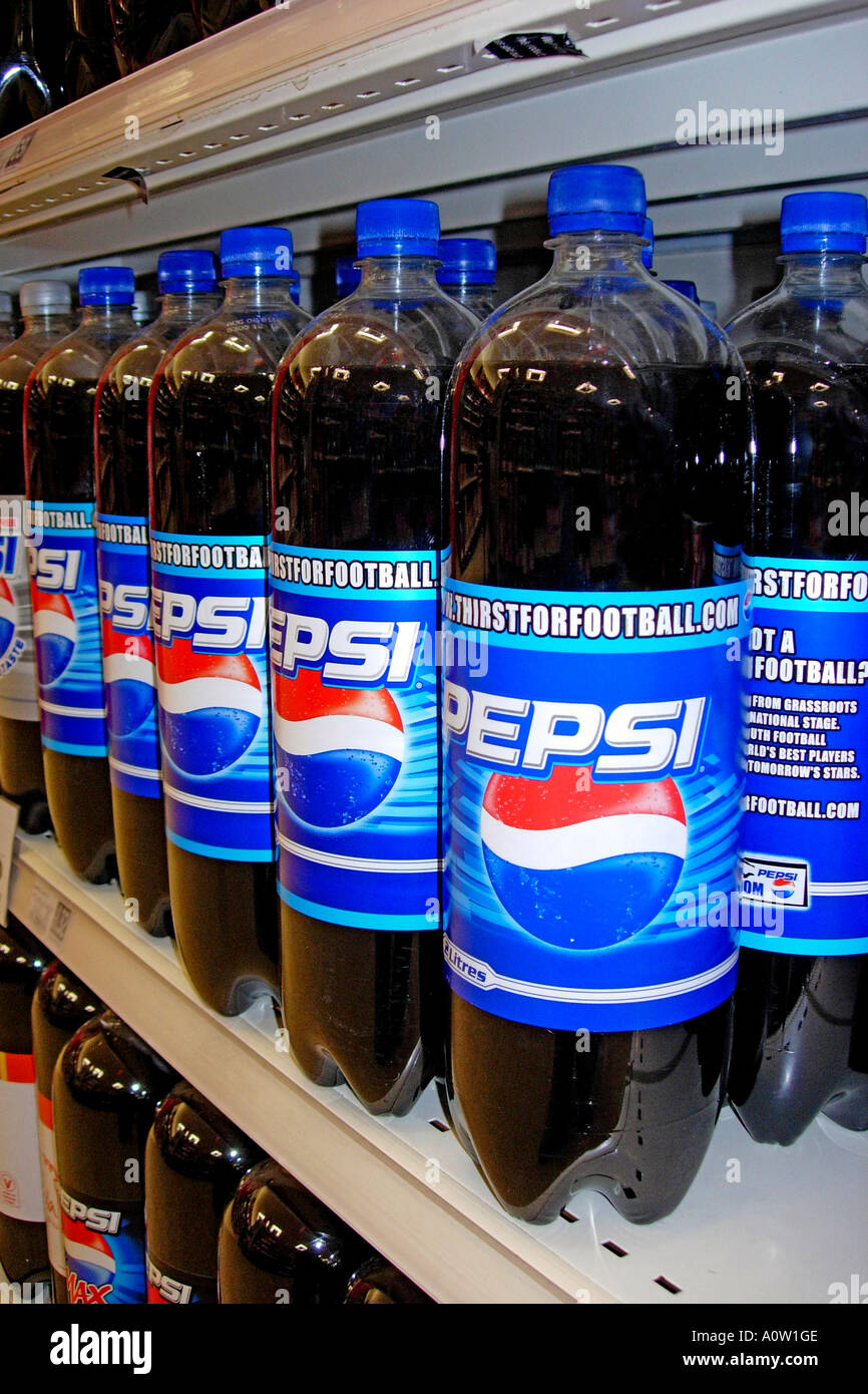 Shelves of fizzy cola drink Stock Photo - Alamy