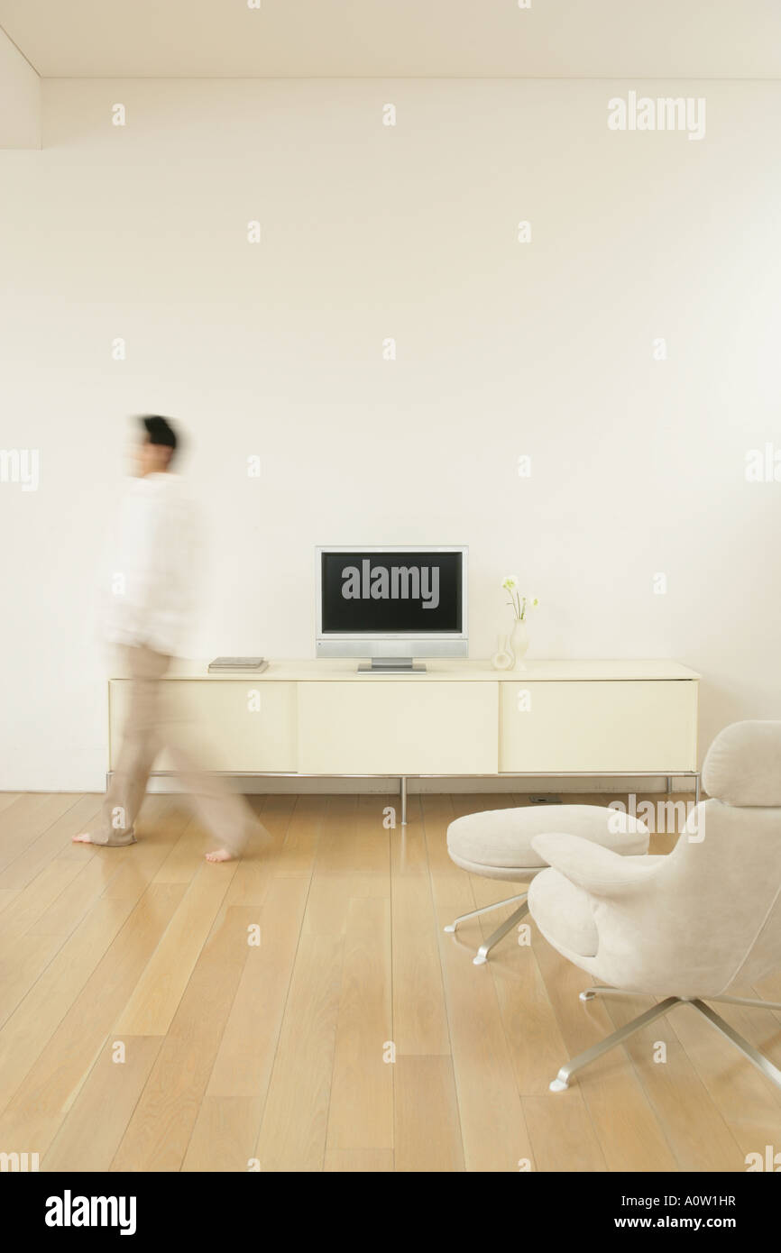 Side profile of a man walking in a room Stock Photo - Alamy