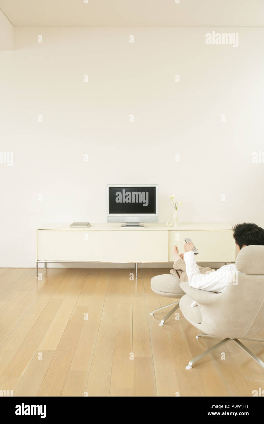 Man sitting in front of his tv set hi-res stock photography and images ...