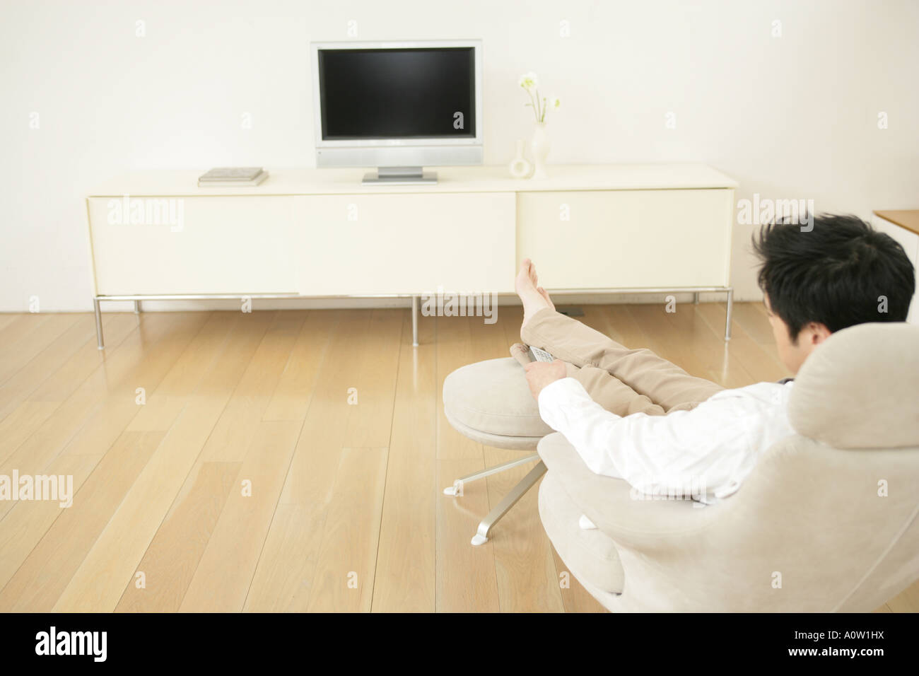 Man sitting in front of his tv set hi-res stock photography and images ...