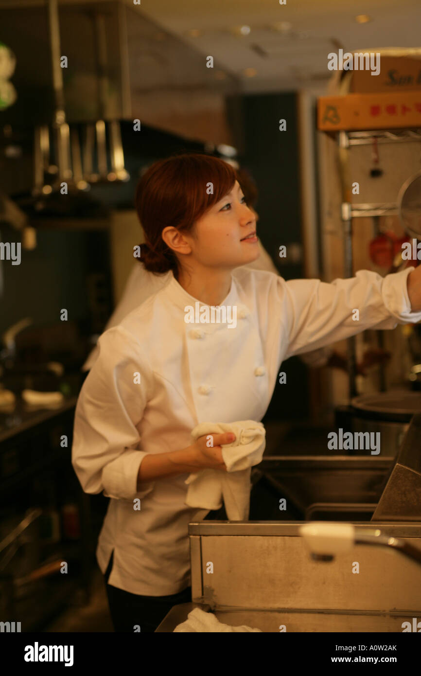 Back view female chef in hi-res stock photography and images - Alamy