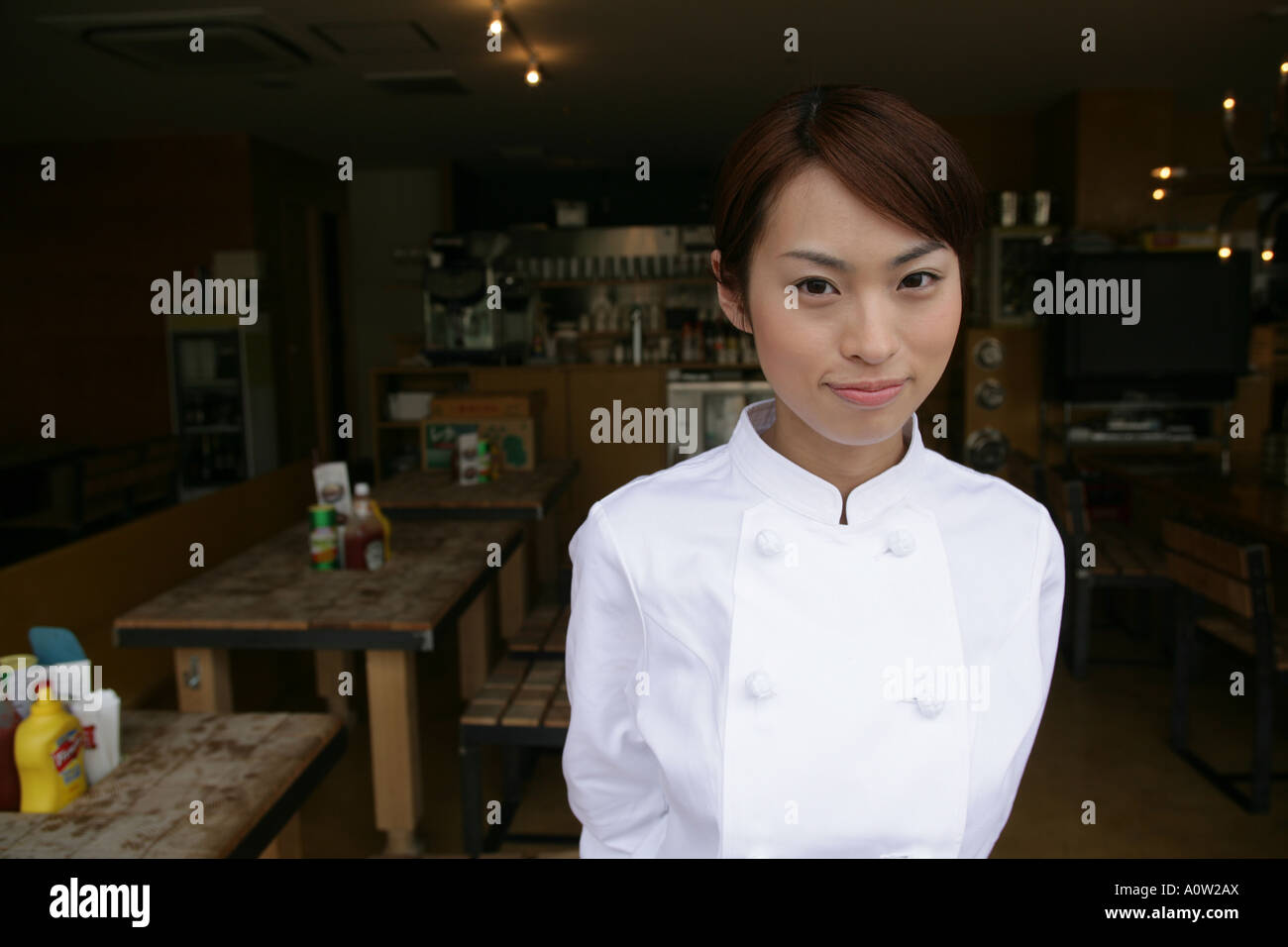 Back view female chef in hi-res stock photography and images - Alamy