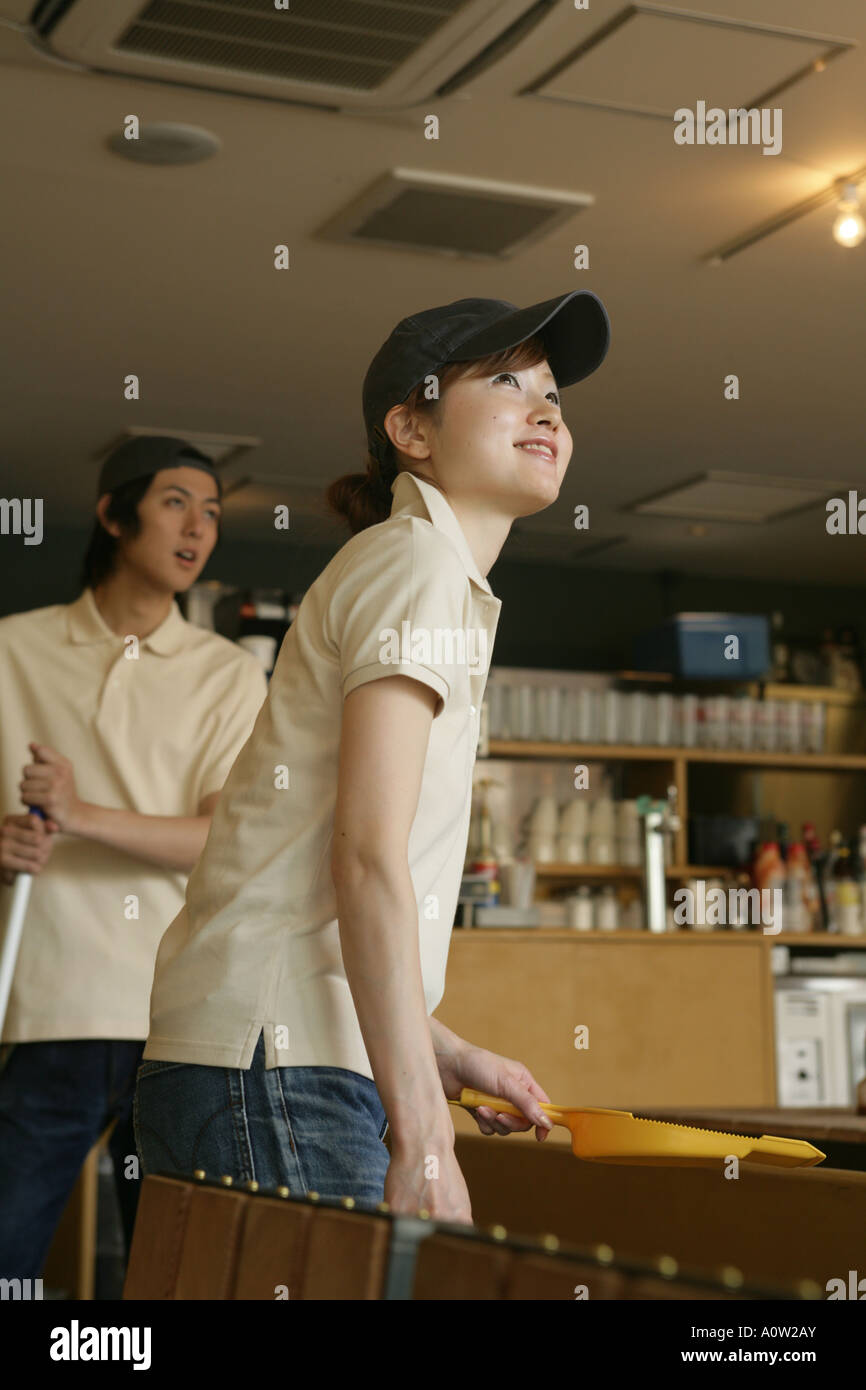 Side profile of a young woman and a young man looking up Stock Photo ...