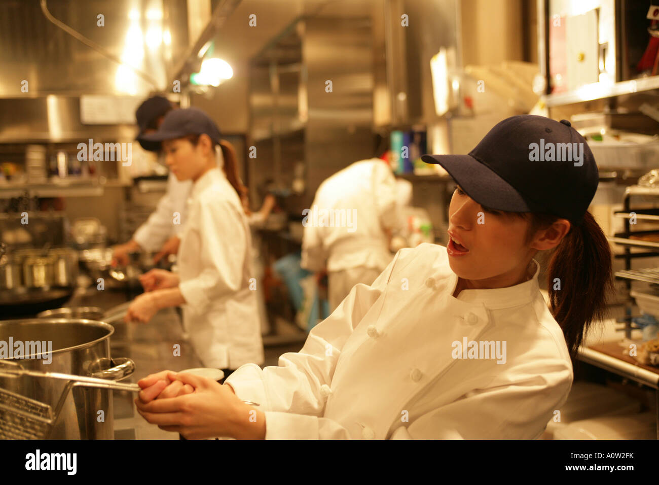 Back view female chef in hi-res stock photography and images - Alamy