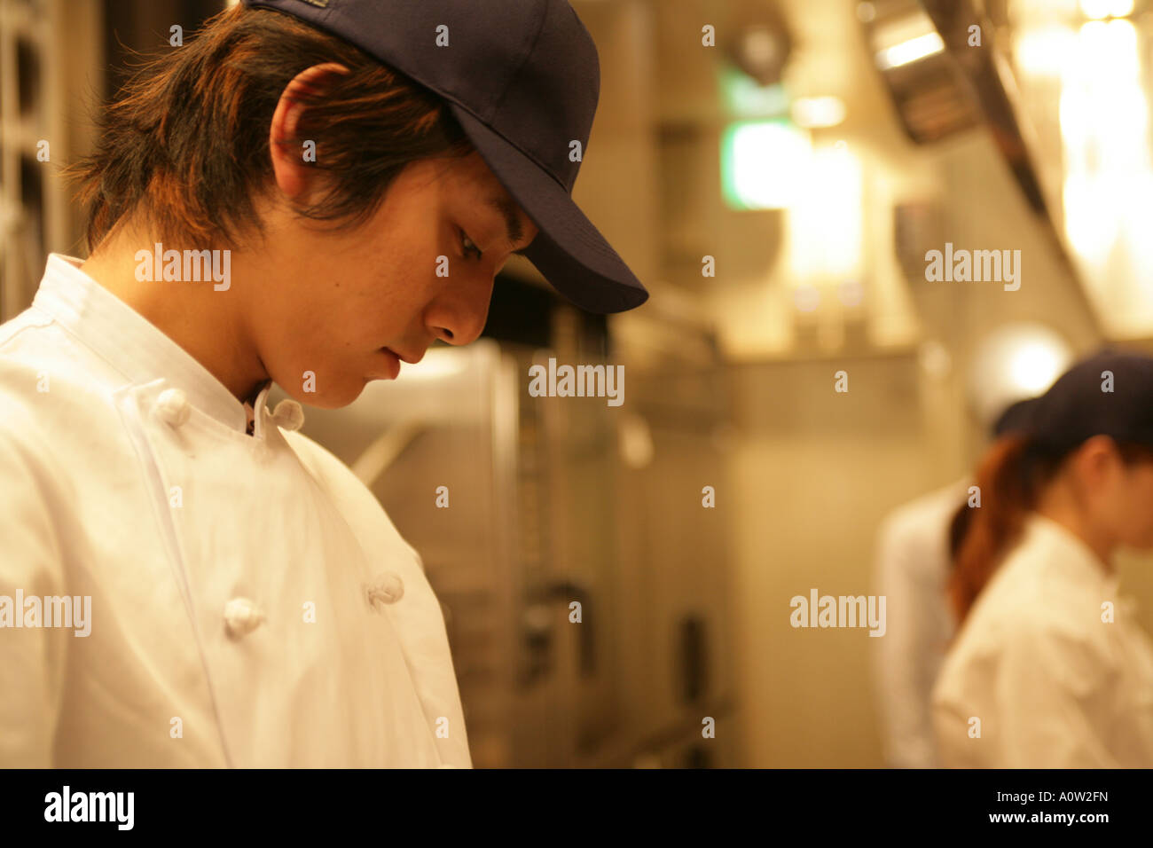 Side profile of a male chef looking down Stock Photo - Alamy
