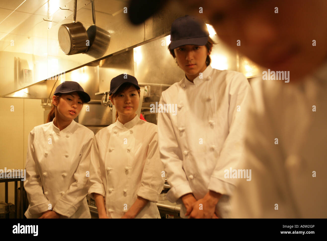 Back view female chef in hi-res stock photography and images - Alamy