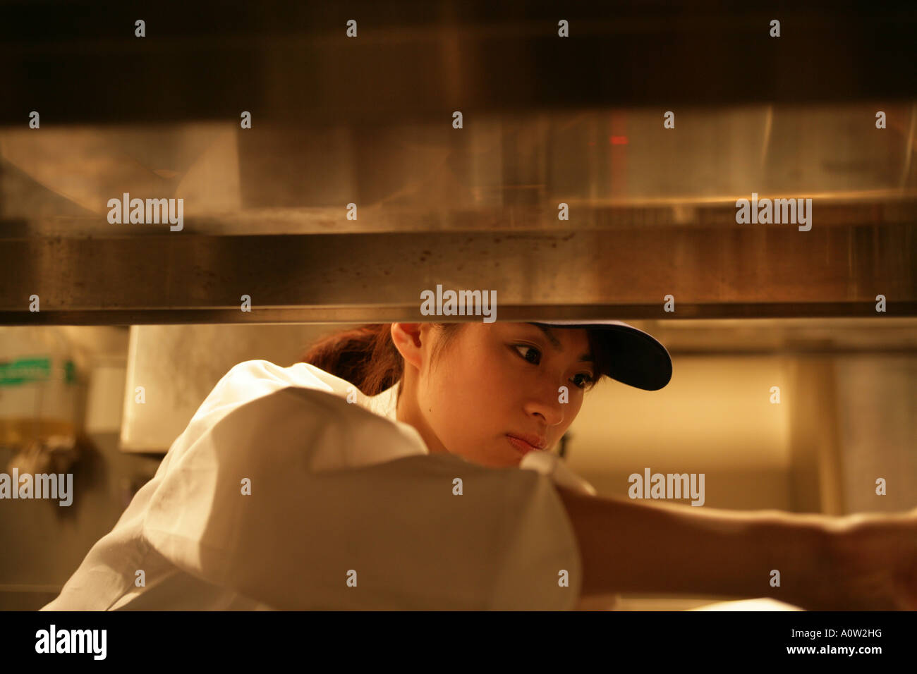 Close up of a waitress looking down Stock Photo - Alamy