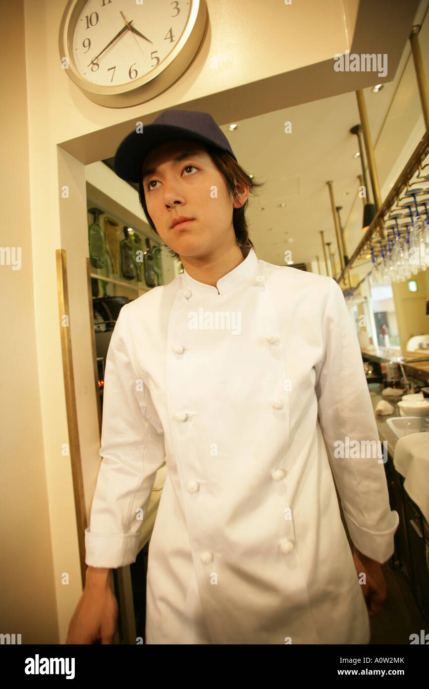Close-up of a waiter standing in the kitchen Stock Photo - Alamy