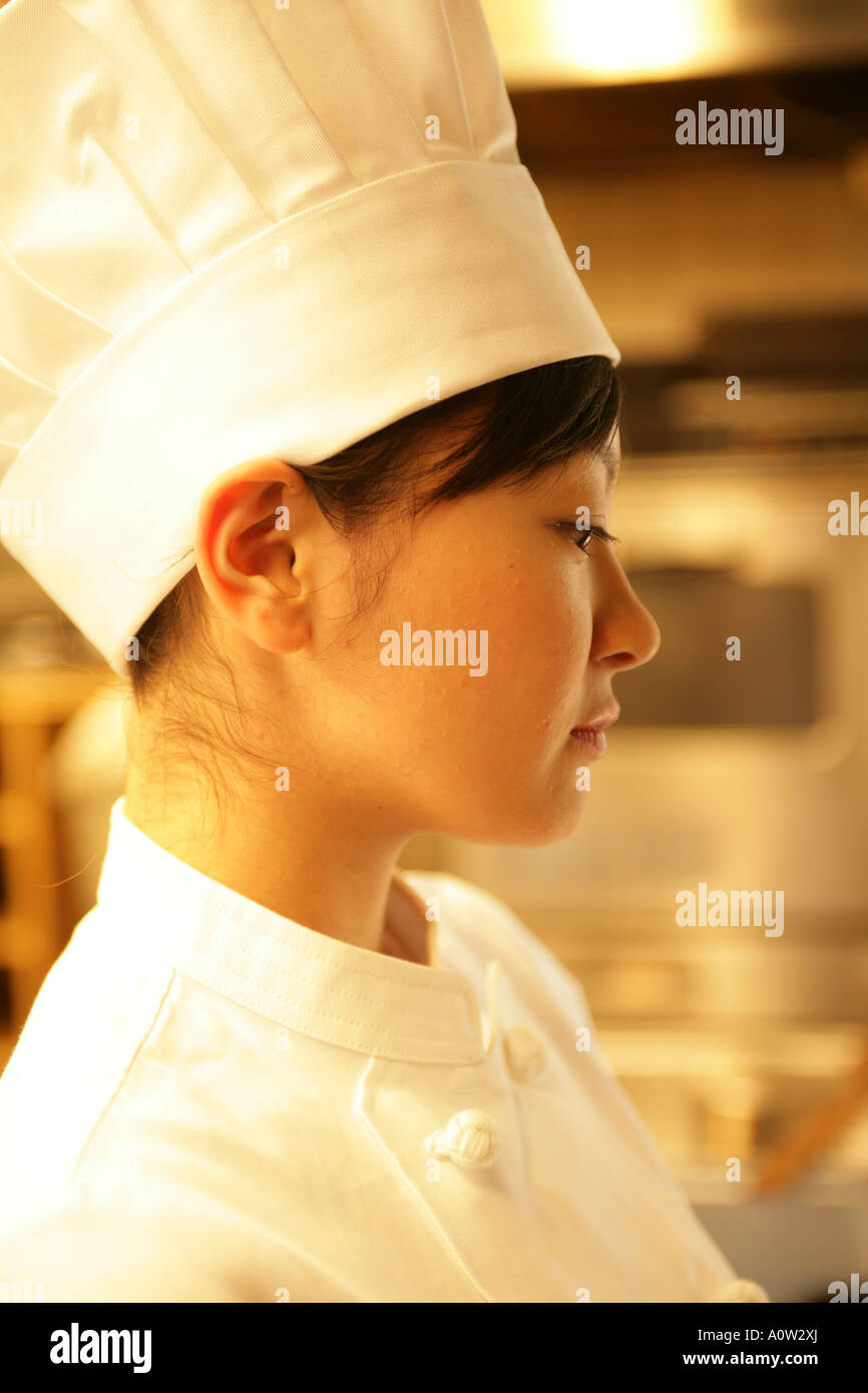 Side profile of a female chef Stock Photo - Alamy