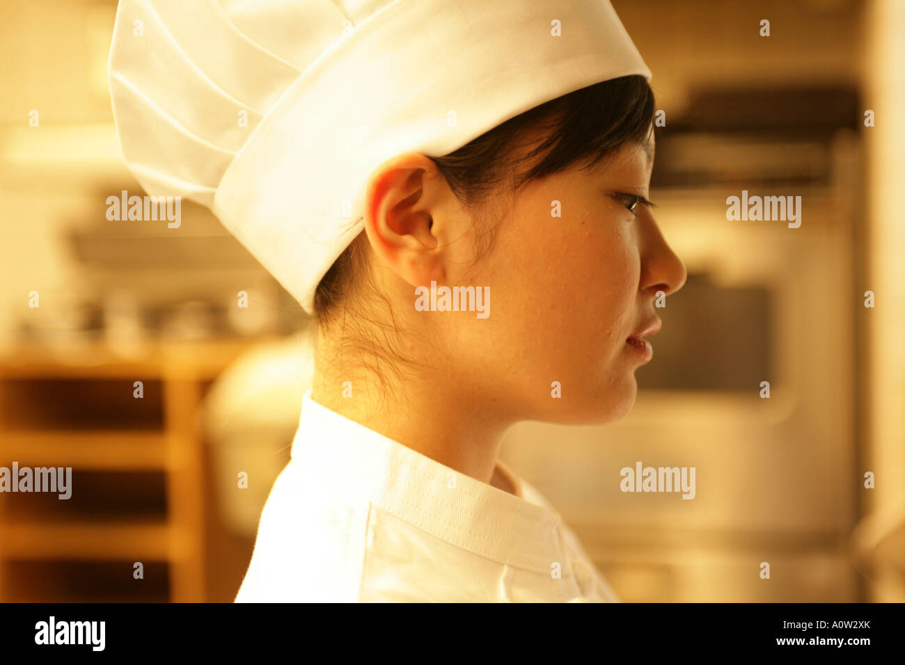 Side profile of a female chef Stock Photo - Alamy
