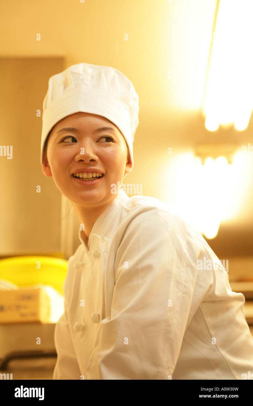 Side profile female chef smiling hi-res stock photography and images ...