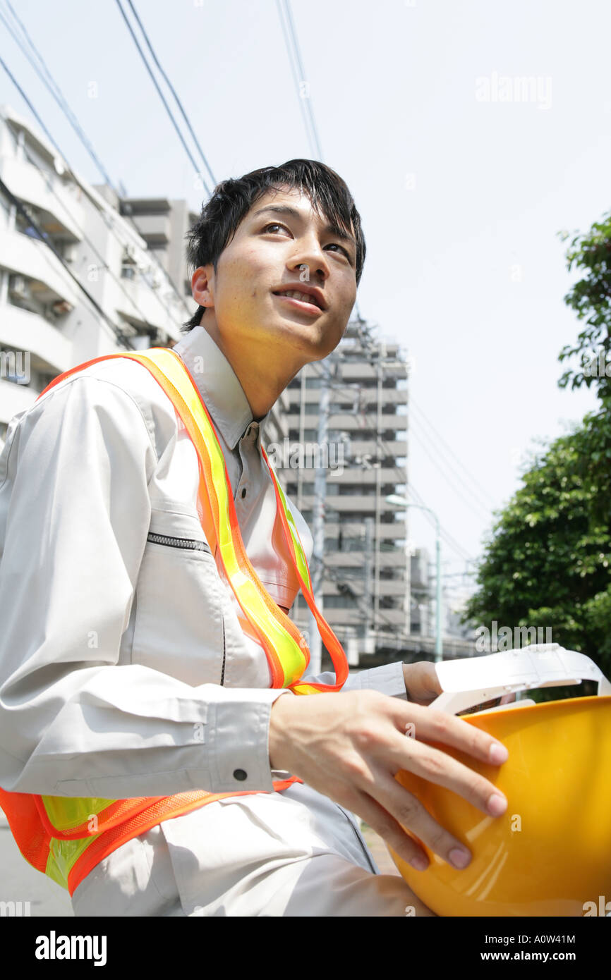 Side profile of a traffic cop holding a hardhat Stock Photo - Alamy