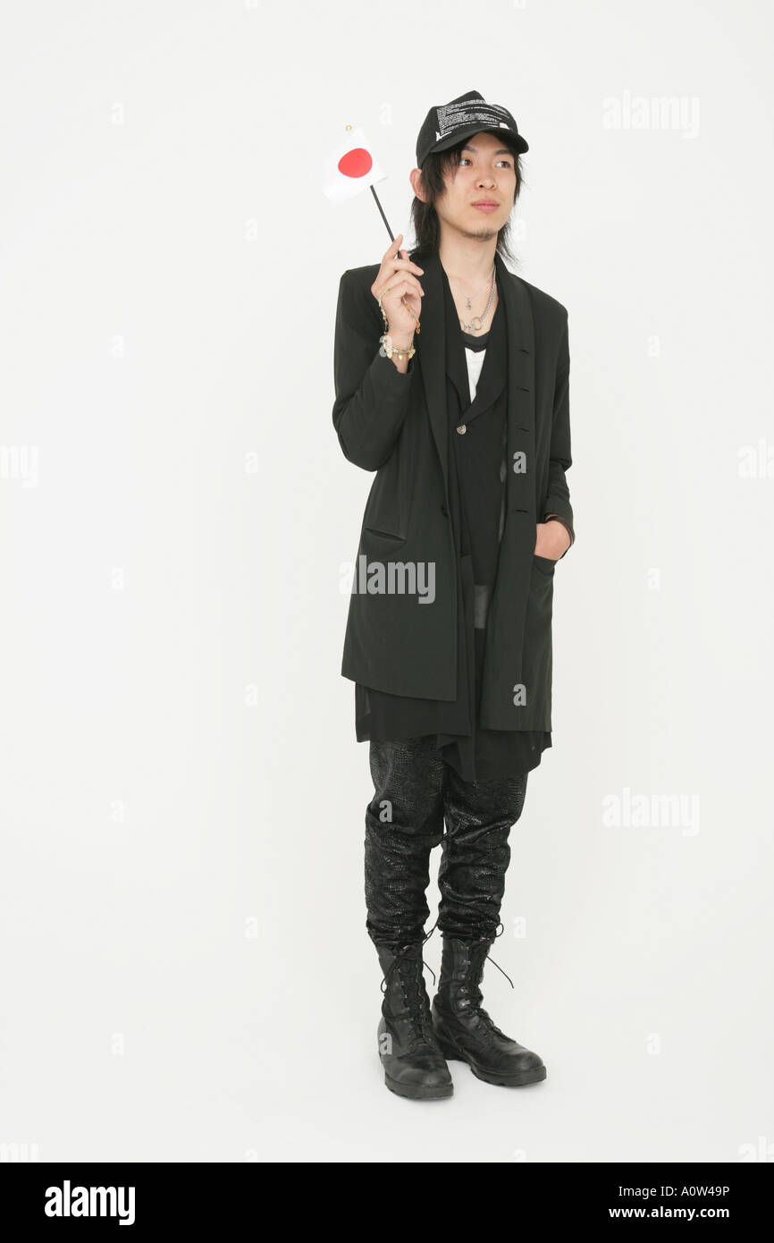 Young man holding a Japanese flag Stock Photo - Alamy