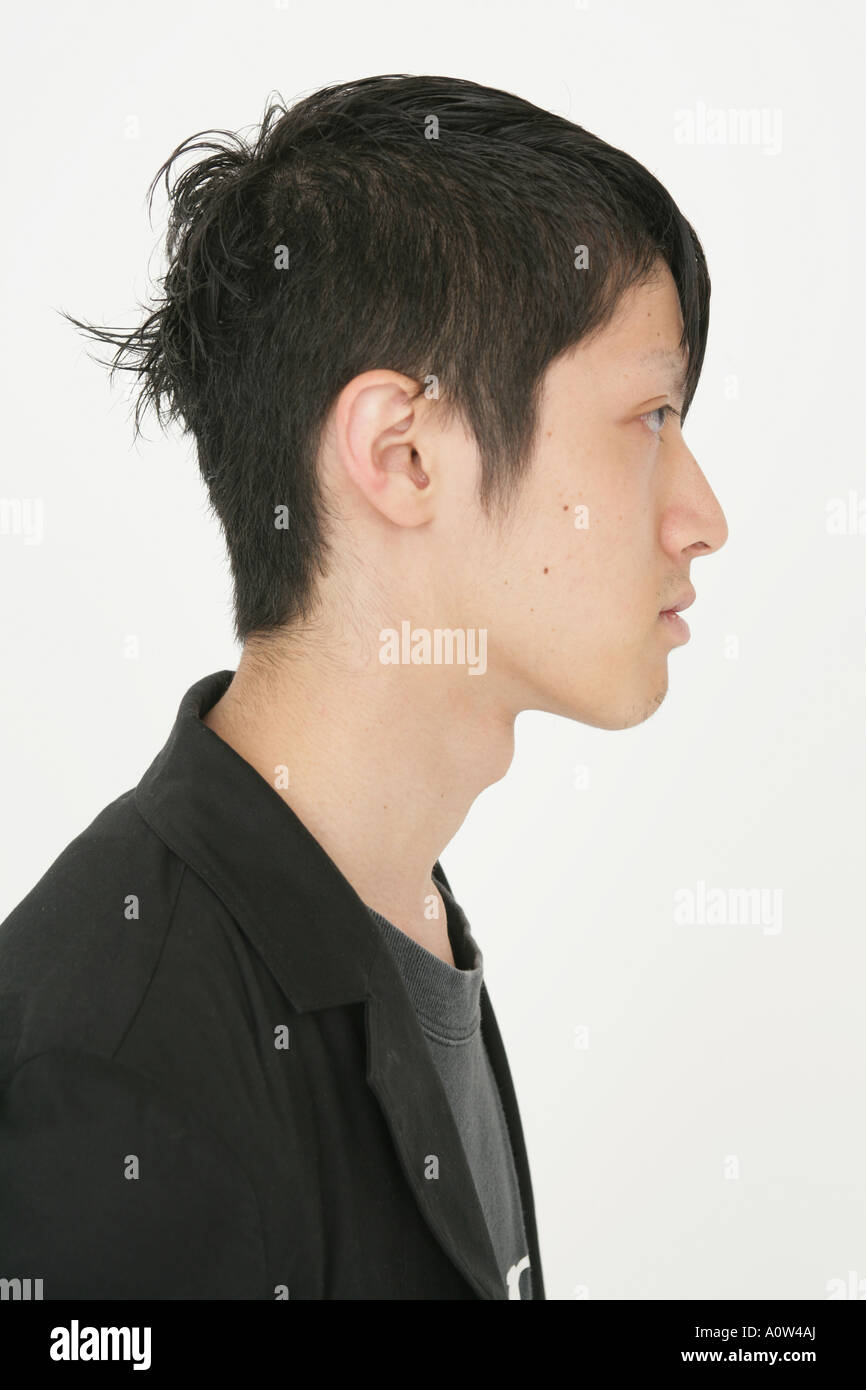 Side profile of a young man looking serious Stock Photo - Alamy
