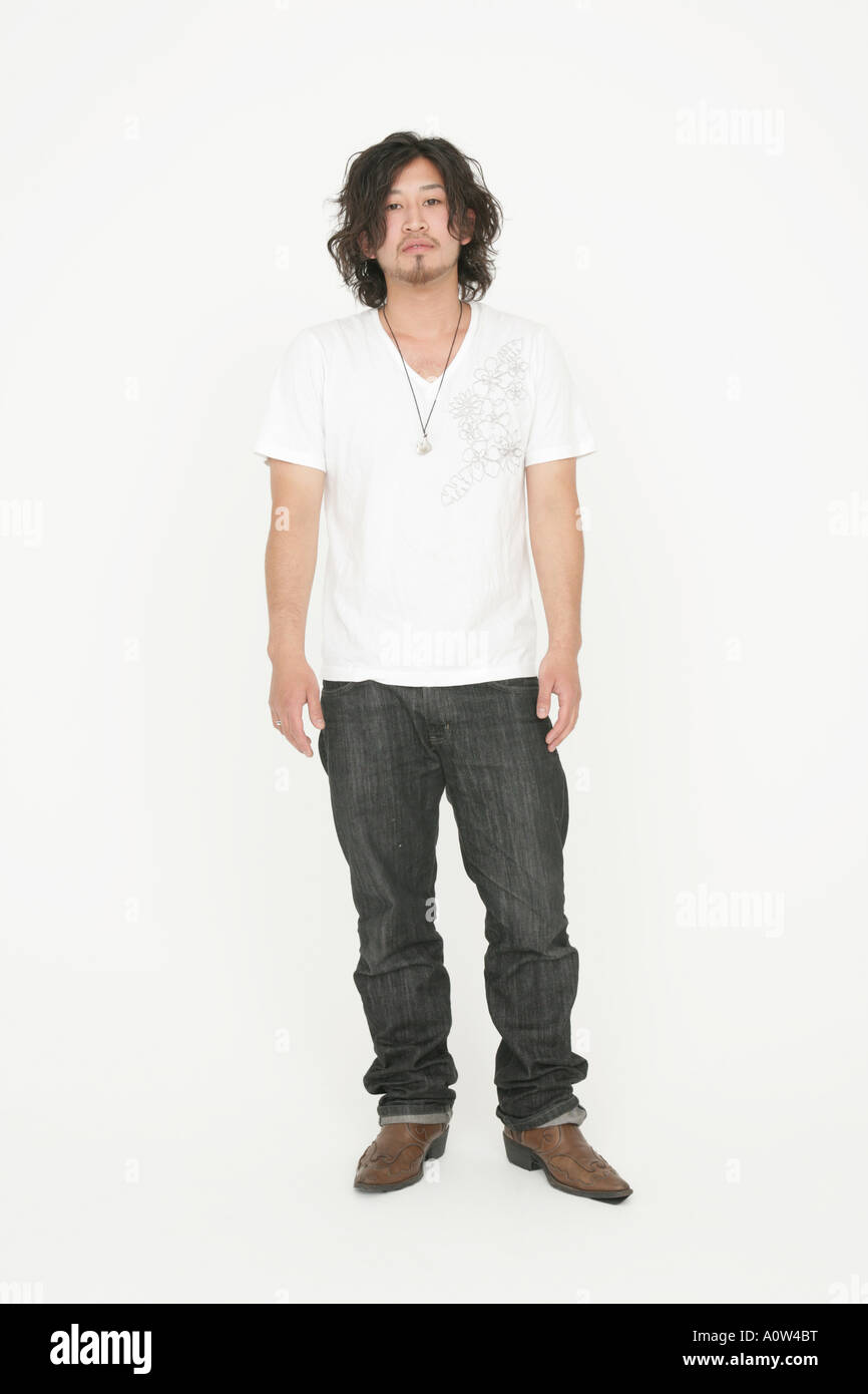 Portrait of a young man standing Stock Photo - Alamy