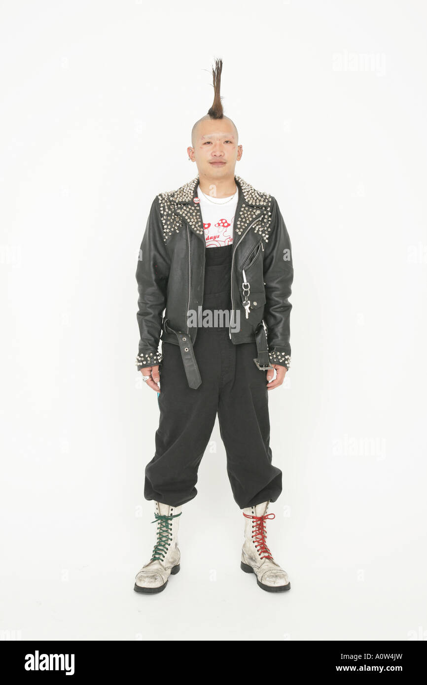 Portrait of a punk young man smiling Stock Photo - Alamy