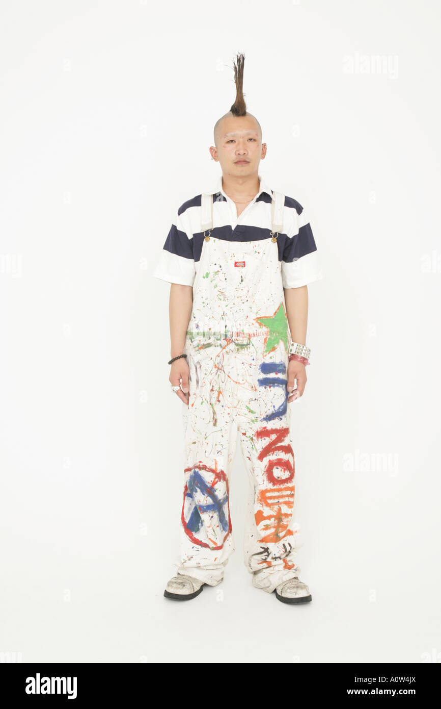 Portrait of a punk young man posing Stock Photo - Alamy