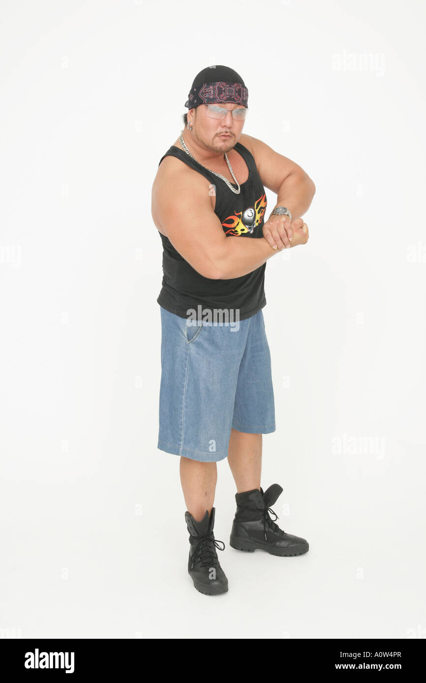 Portrait of a mid adult man flexing his muscles Stock Photo - Alamy