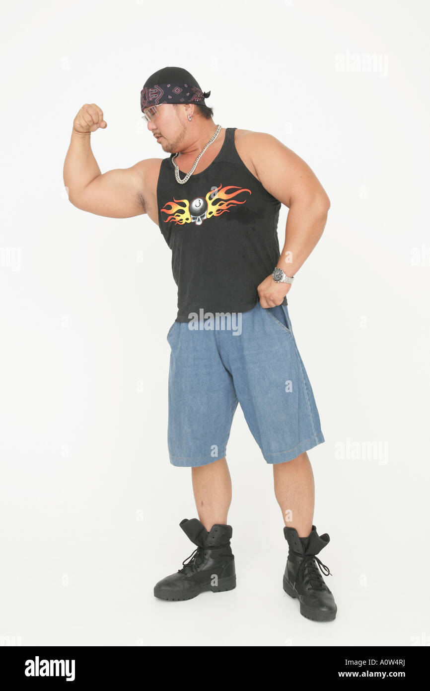 Mid adult man flexing his muscles Stock Photo - Alamy