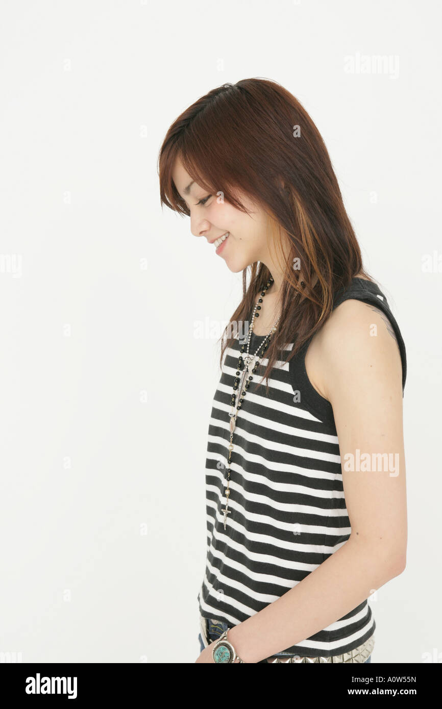 Side profile of a young woman smiling Stock Photo - Alamy