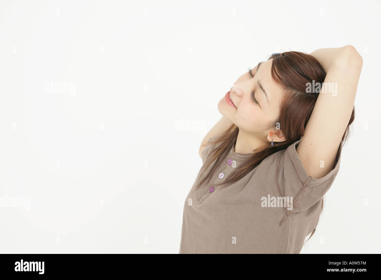Side profile of a young woman stretching Stock Photo - Alamy