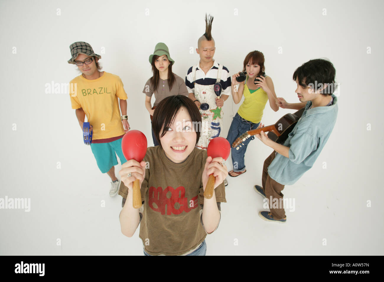 Cheerful couple playing musical instruments hi-res stock photography ...