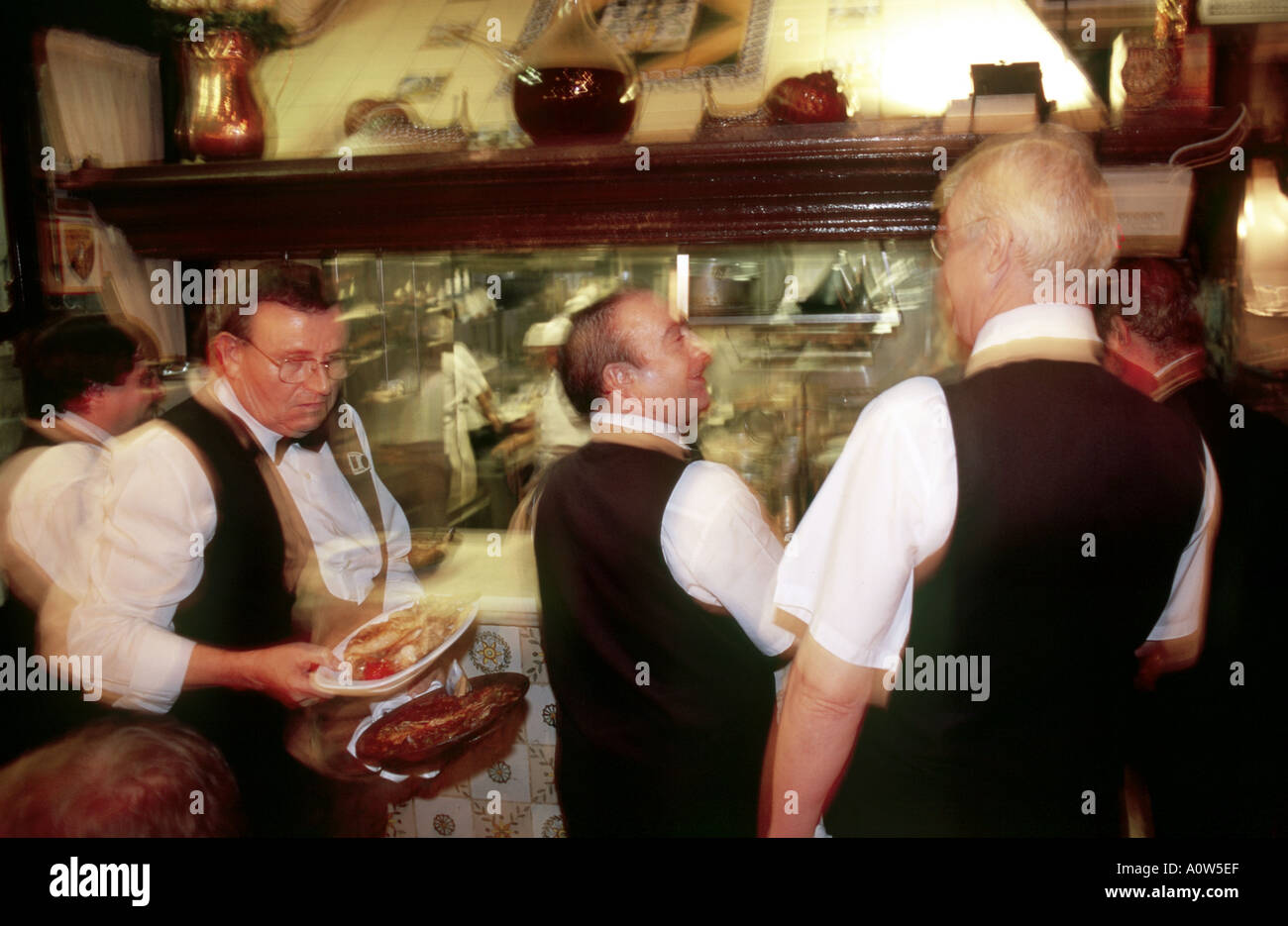Waiters in discussion at Los Caracoles restaurant Barcelona c Luke ...