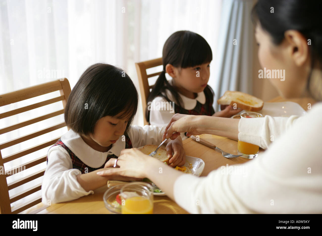 Two girls serving table hi-res stock photography and images - Alamy