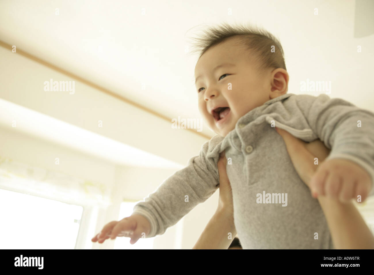 Mother holding baby close hi-res stock photography and images - Alamy