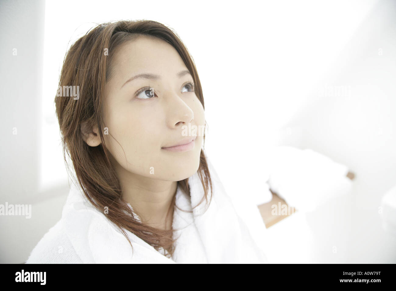 Woman young looking up smiling hi-res stock photography and images - Alamy