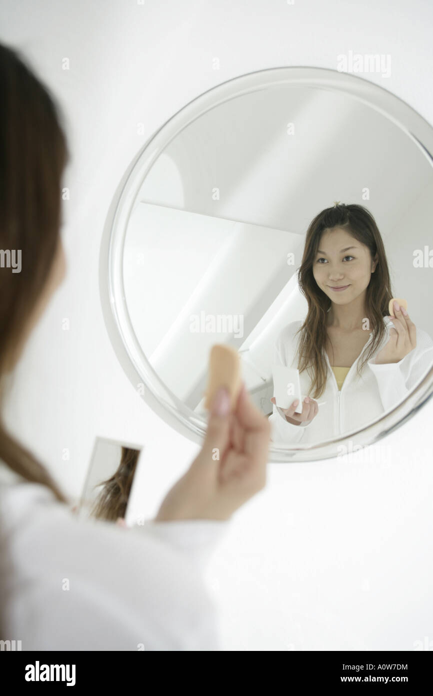 Woman holding powder puff hi-res stock photography and images - Alamy