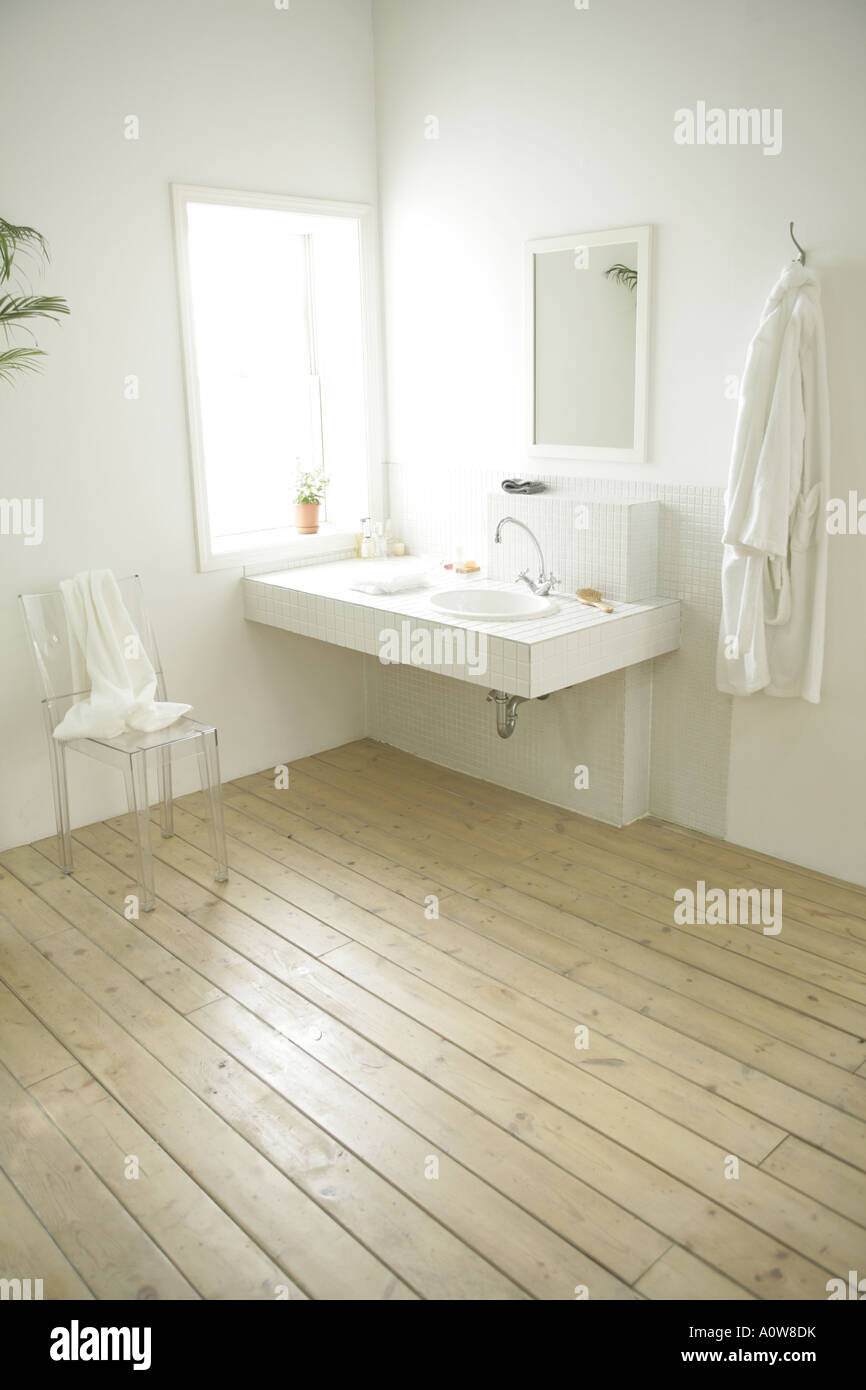 Bathroom sink beside a window Stock Photo - Alamy