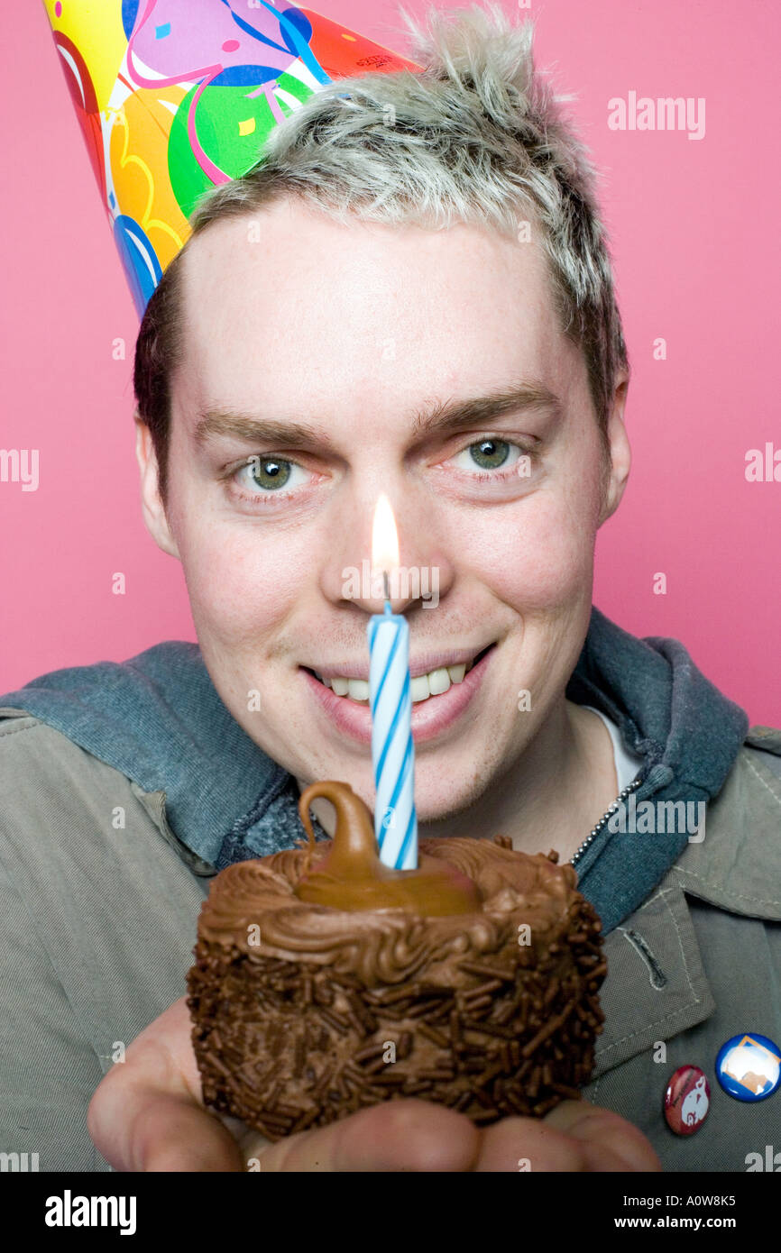 Portrait Caucasian man with birthday cake Stock Photo - Alamy