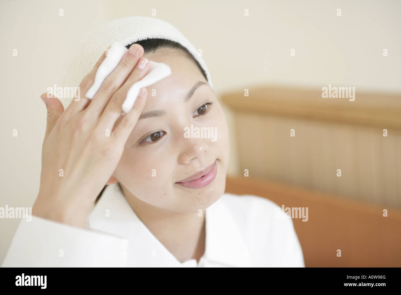 Close up of a young woman wiping her face with a handkerchief Stock ...