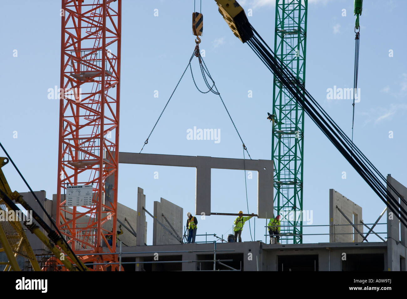 Construction crane lifting precast concrete hi-res stock photography ...