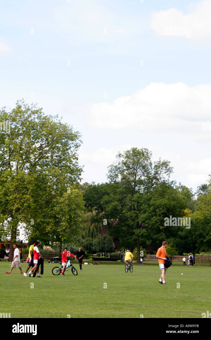 people playing football in a park, London Stock Photo - Alamy