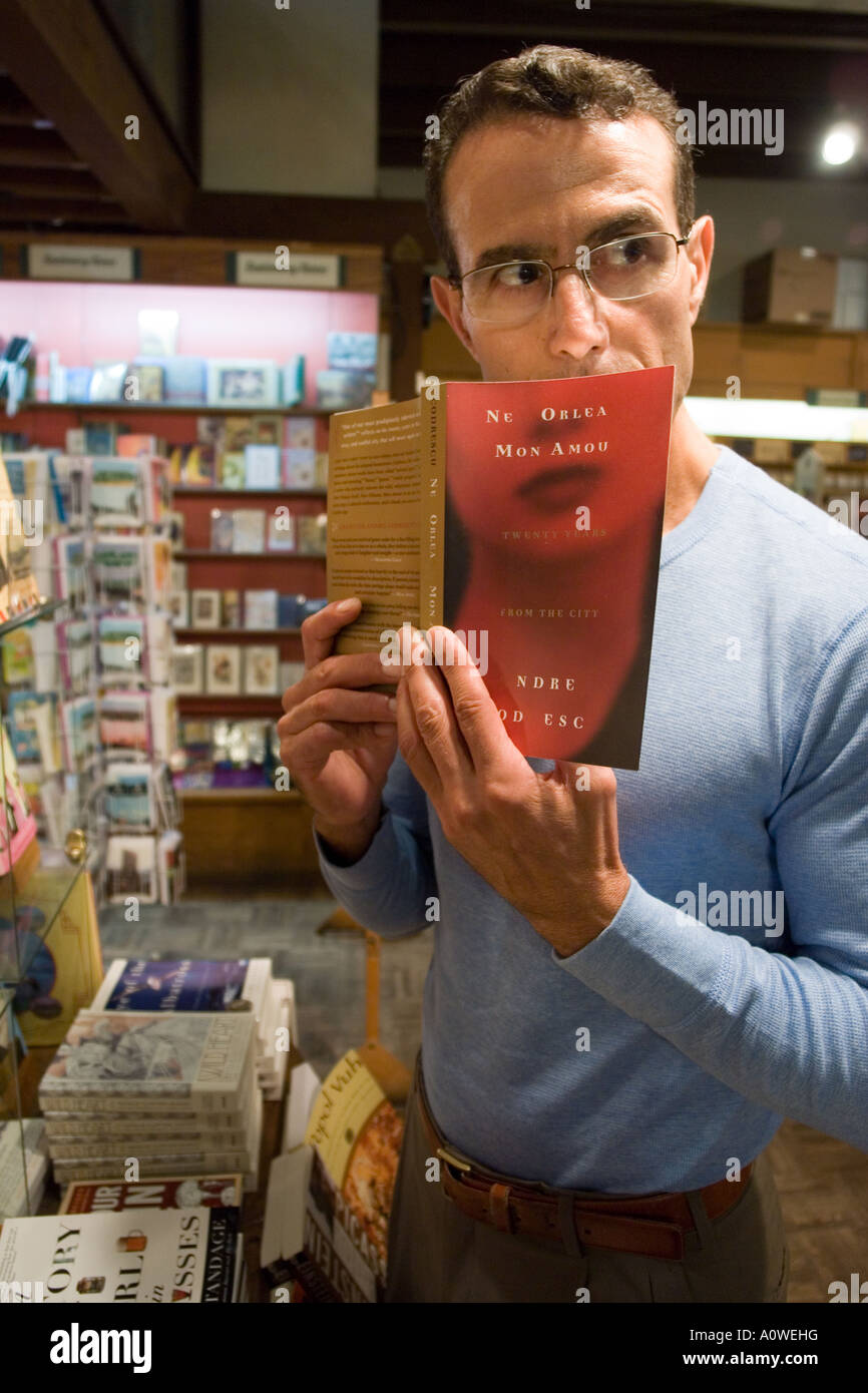 Man reading book by bookstand Stock Photo - Alamy