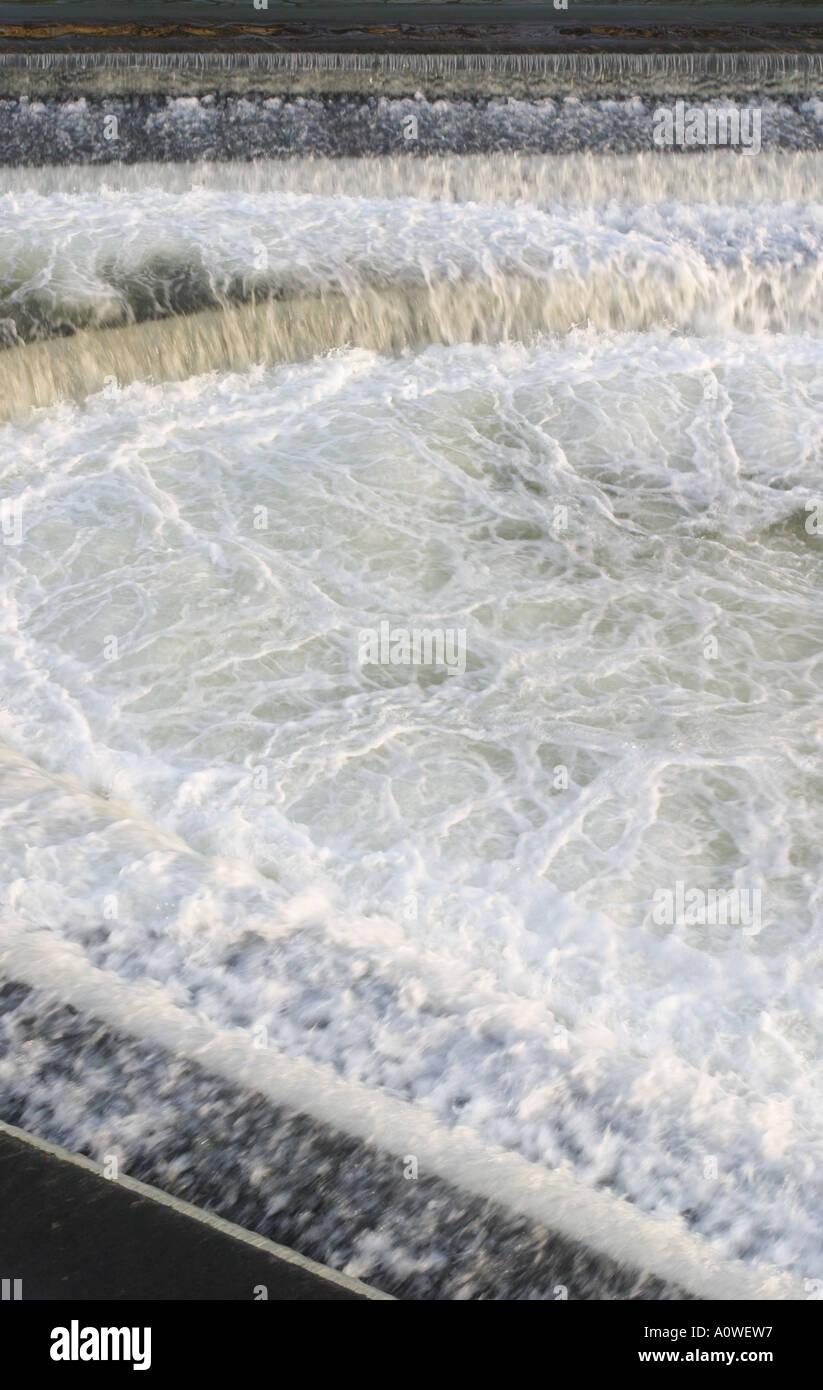 River weir fast flowing river water current Stock Photo - Alamy