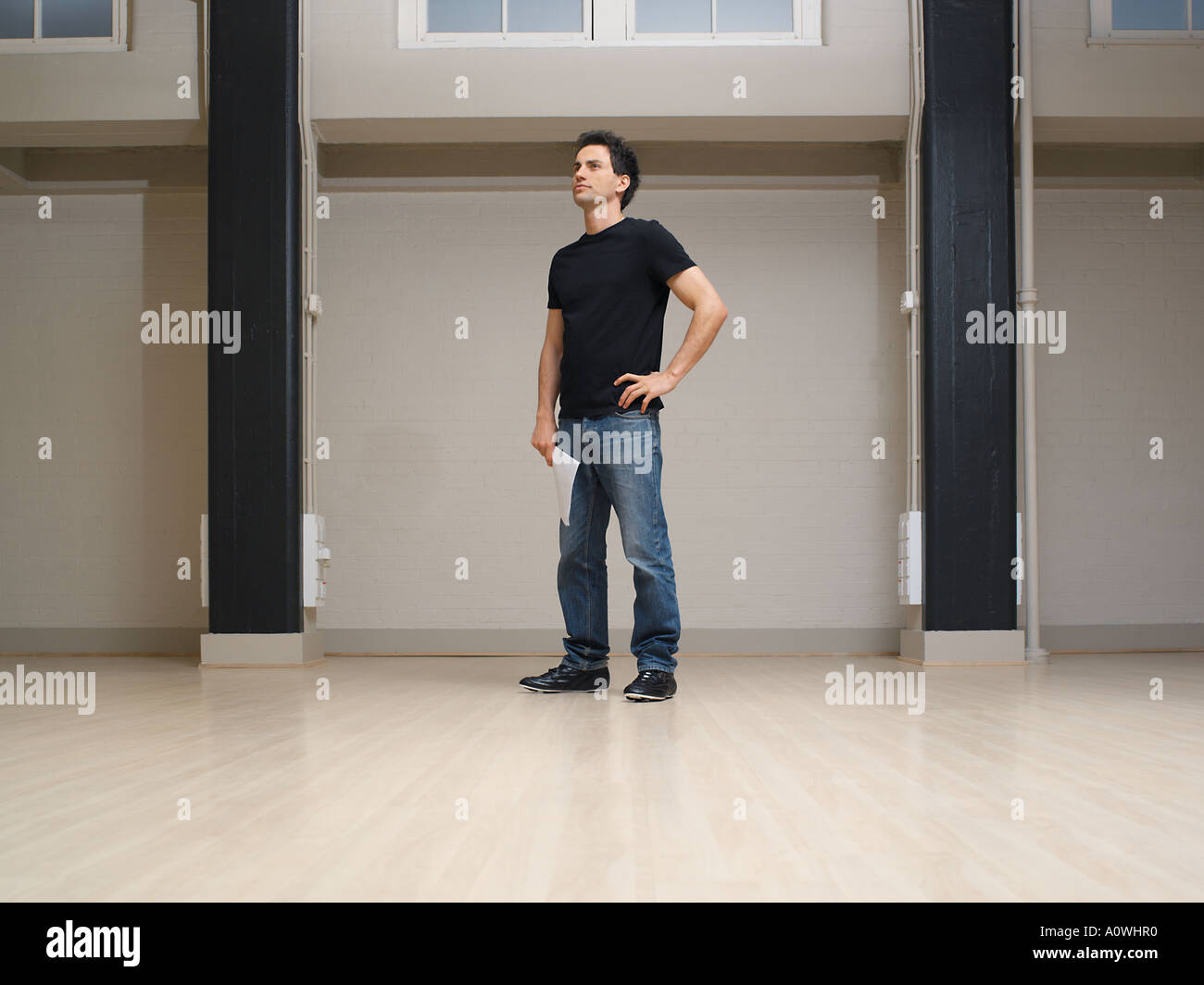 Man in an empty office space Stock Photo - Alamy