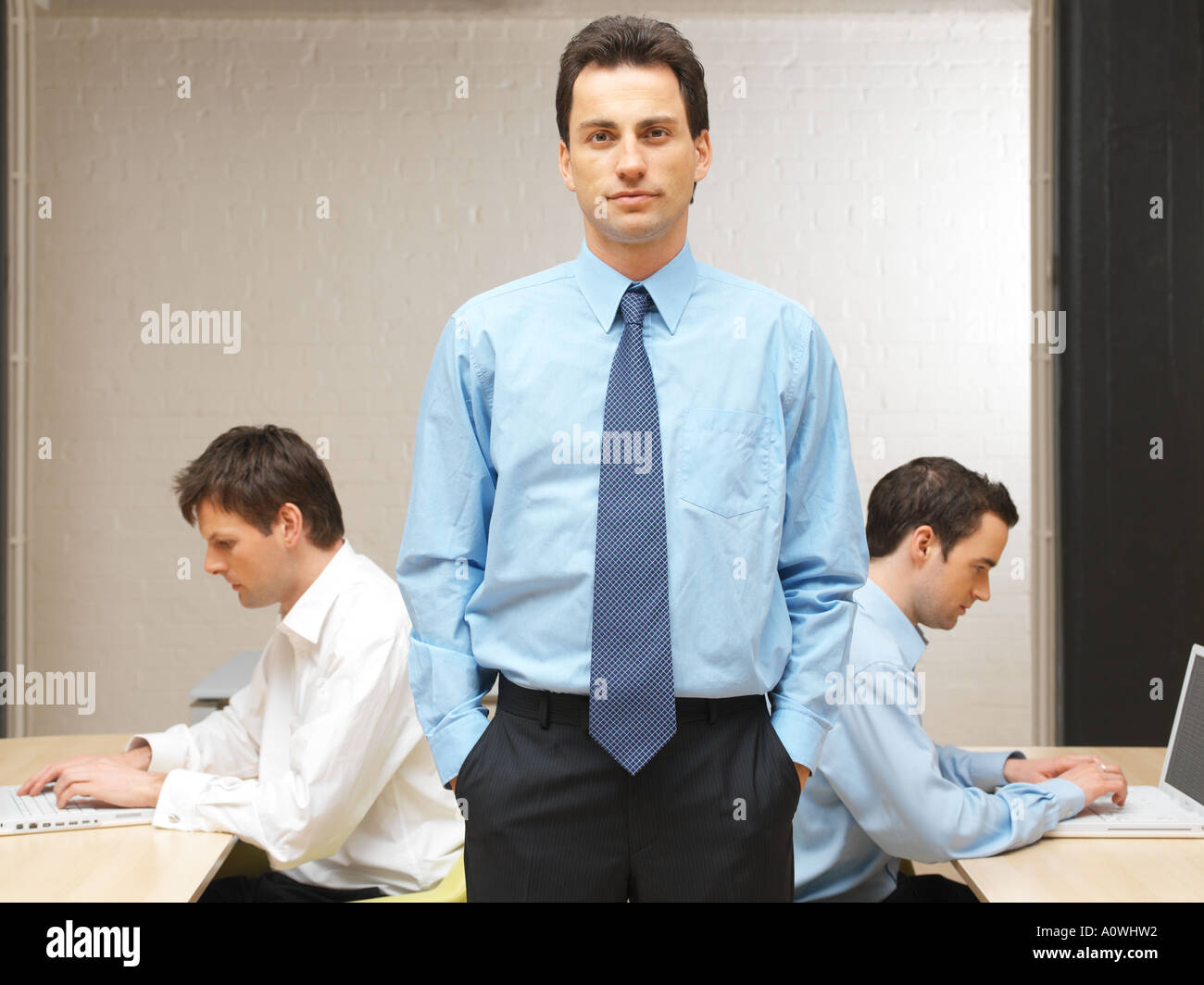 Three young employees using hi-res stock photography and images - Alamy