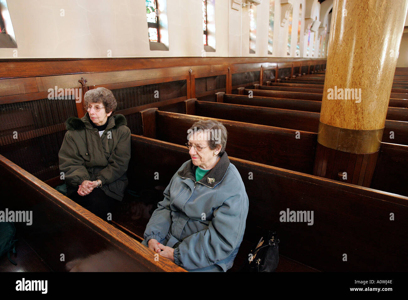Two women pray Roman Catholic church Stock Photo - Alamy